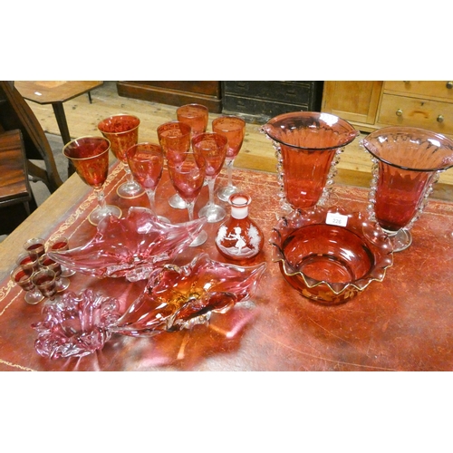 A collection of ruby and cranberry glass to include a set of six wine ...