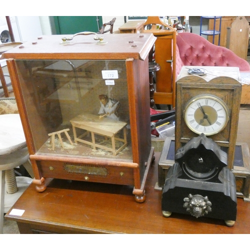 An Automaton figure in cabinet, a mantel clock and a clock case