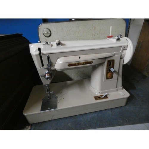 Three old sewing machines