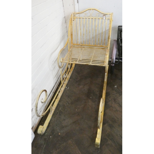 A gold coloured metal Christmas sleigh