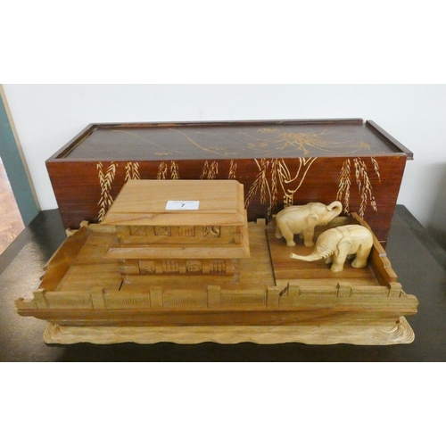 A wooden carved model of Noah's Ark complete with animals and a box ...