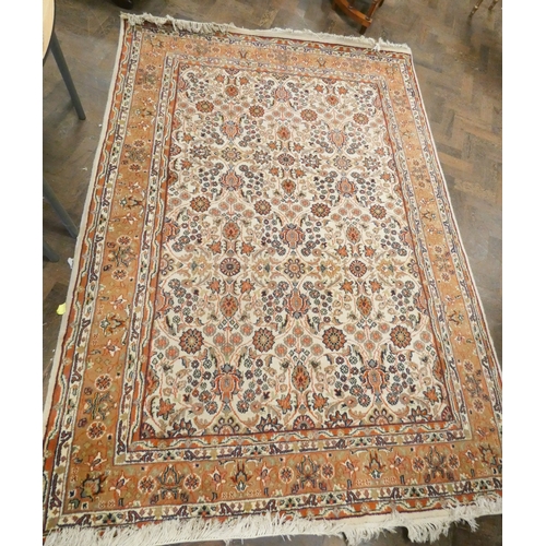 A fawn and patterned Persian design wool pile rug, 96" x 68"