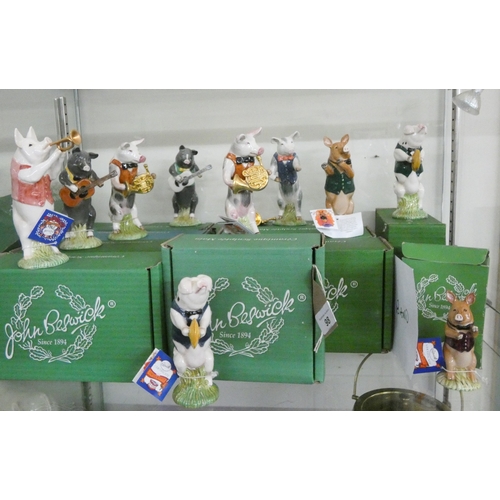 A Beswick ten piece pig band with certificates and original boxes