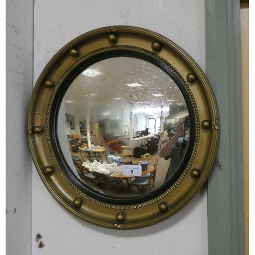 A Regency style circular convex mirror in gilt frame