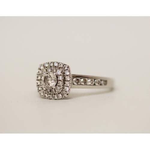 A modern square diamond cluster ring, with diamond shoulders, total ...