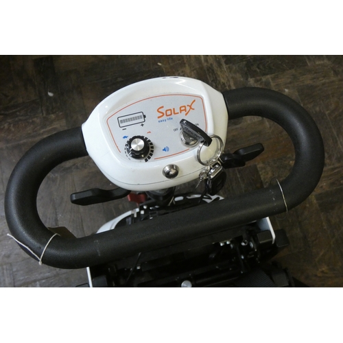 A Solax Easy life fold-up mobility scooter with charger etc