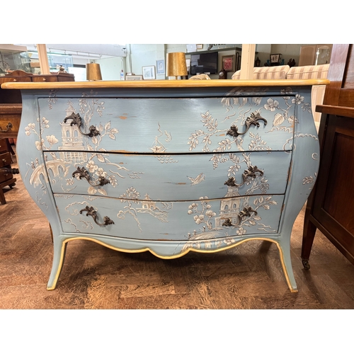 A chinoiserie painted pale bombe fronted mahogany chest of three long ...