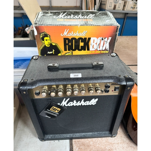 A Marshall series MG15DFX guitar amplifier with its original box