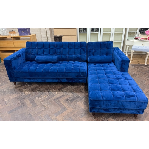 A modern chaise ended corner sofa, modular units in buttoned blue ...