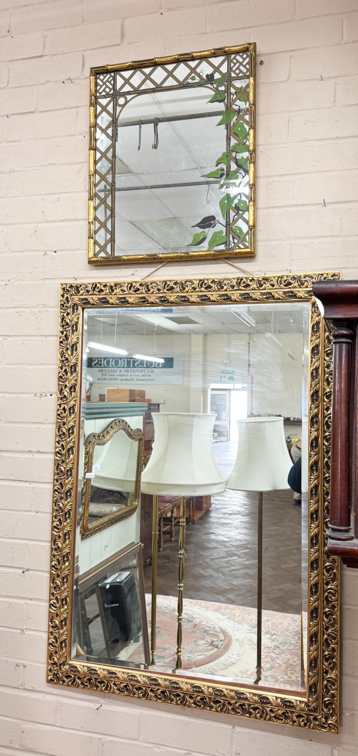 A large rectangular gilt framed wall mirror and a smaller vintage wall ...