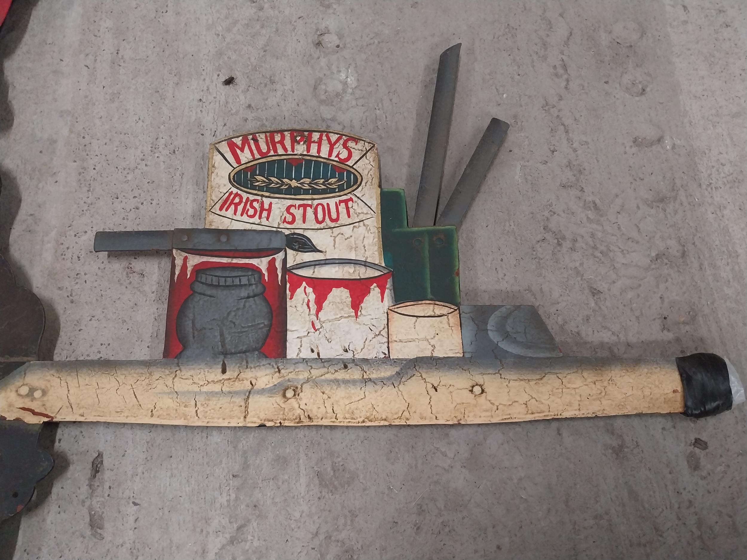 Murphy's Irish Stout tinplate painting man hanging advertising sign {}.