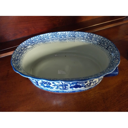 Blue and white ceramic foot bath {13 cm H x 41 cm W x 24 cm D}.
