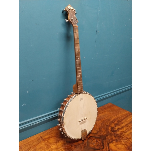 The Vernon four string Banjo. {86 cm H x 31 cm W x 7 cm D}.