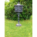 Cast alloy free standing post box.
