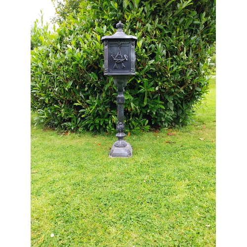 Cast alloy free standing post box.