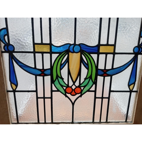 Victorian stain glass window red flower and blue bow design ...