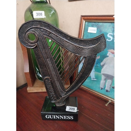 Metal Guinness Harp on stand. {34 cm H x 24 cm W x 7 cm D}.