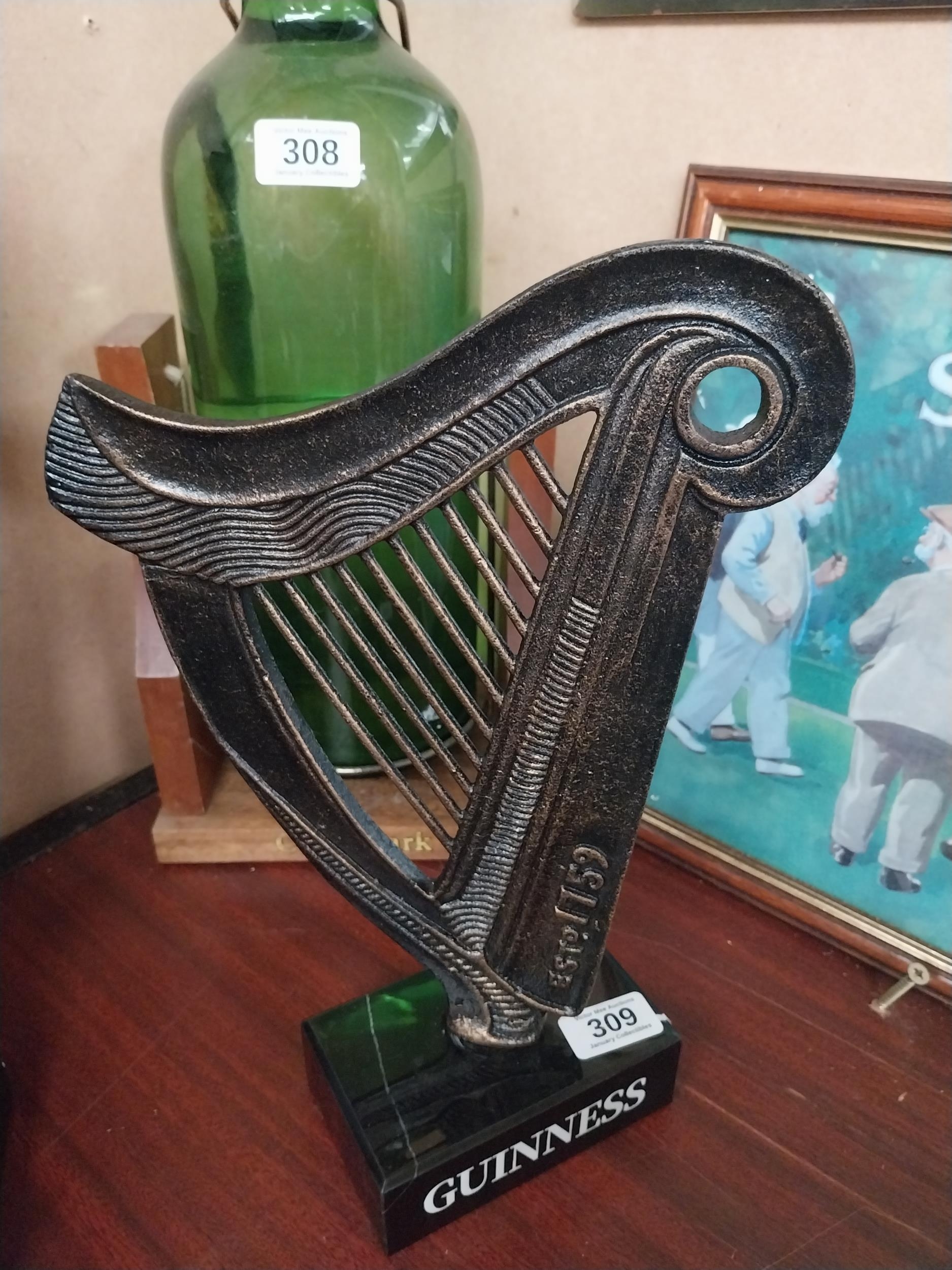 Metal Guinness Harp on stand. {34 cm H x 24 cm W x 7 cm D}.