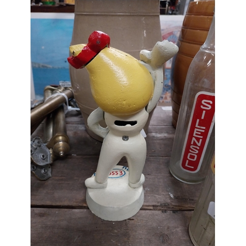 Cast iron Esso girl. {26 cm H x 10 cm W x 10 cm D}.