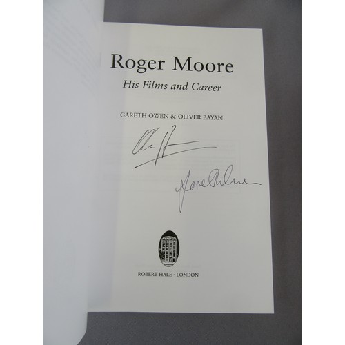 ROGER MOORE BOOKS to include signed copies. (Signatures are believed to ...
