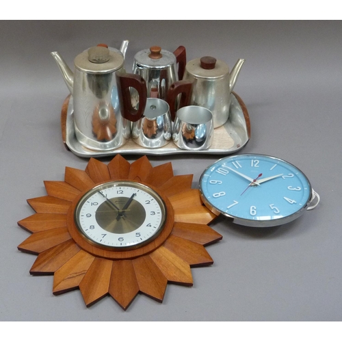 A Metamec electric wall clock with powder blue face moulded Arabic ...