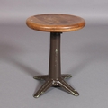 A Singer sewing stool, on cast iron revolving adjustable pedestal and ...