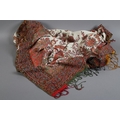 A 19th century square woven Norwich shawl, the cream centre with ...