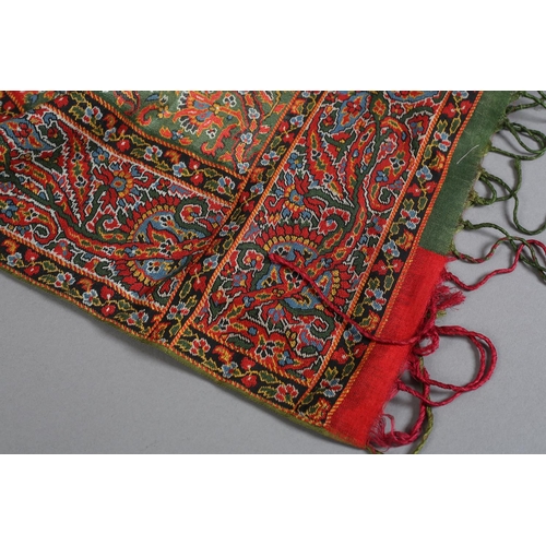 A 19th century square woven Norwich shawl, the cream centre with ...