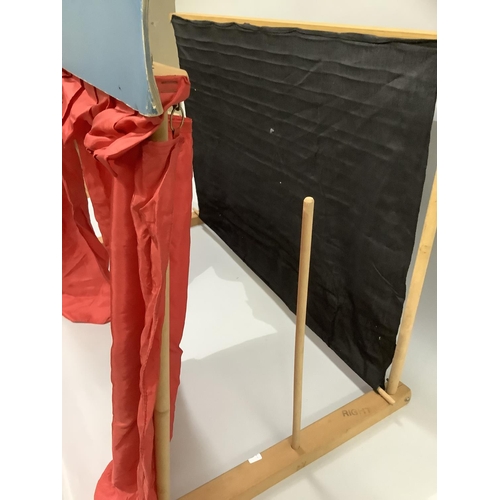 Puppet Theatre with pull back red curtain, black back drop with wooden ...