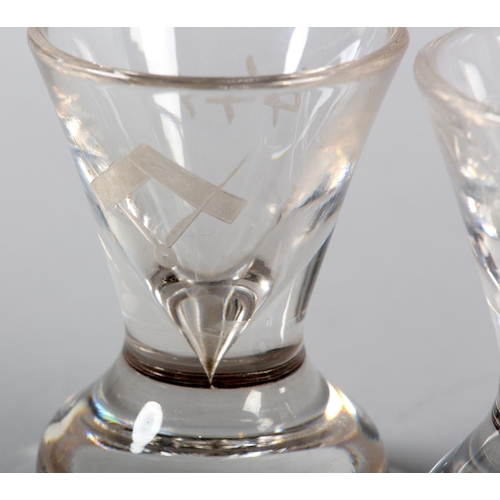 A PAIR OF MASONIC TOASTING GLASSES, etched with a square and compass ...