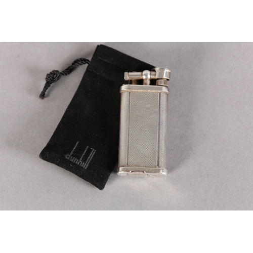 A DUNHILL 'UNIQUE' LIFT ARM PETROL LIGHTER No. 484316 engine turned, silver plated, signed and numbe