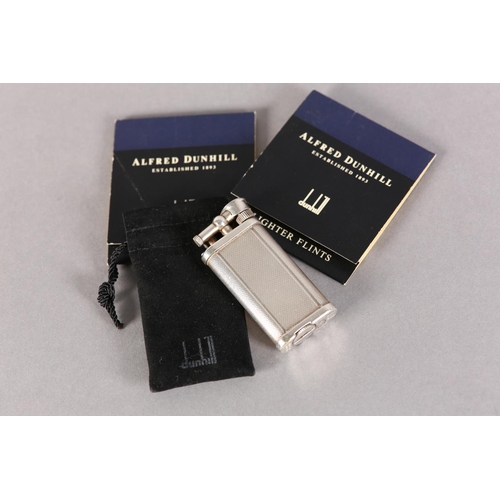 A DUNHILL 'UNIQUE' LIFT ARM PETROL LIGHTER No. 484316 engine turned, silver plated, signed and numbe