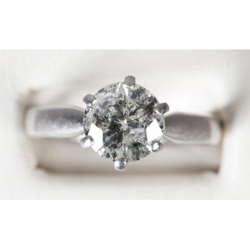 A SINGLE STONE DIAMOND RING in platinum, the brilliant cut stone claw ...