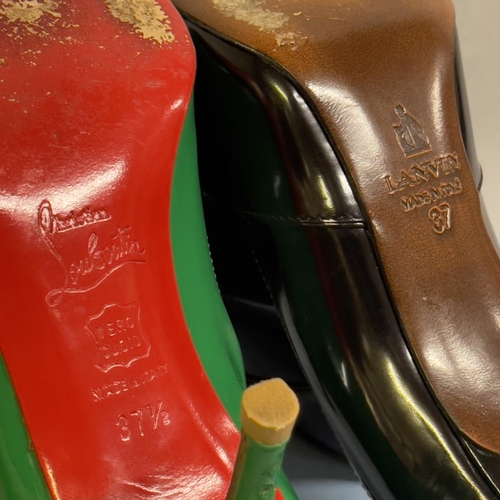 A pair of patent leather very high heeled shoes by Lanvin, having a ...