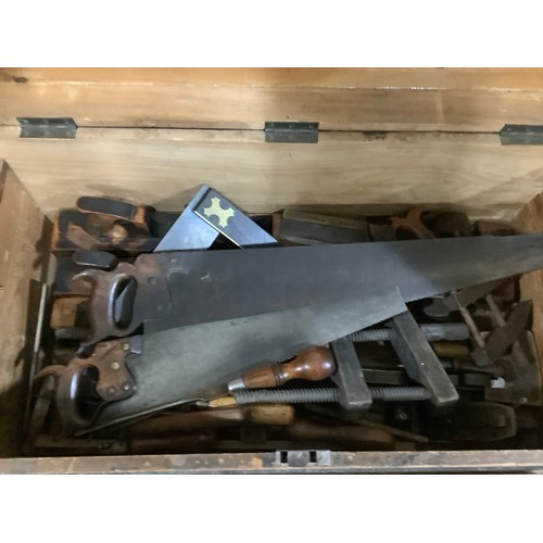 An ebonised pine tool chest containing a large quantity of antique and ...