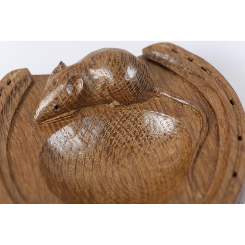 'MOUSEMAN' THOMPSON OF KILBURN, An oak horseshoe pin dish, carved in ...