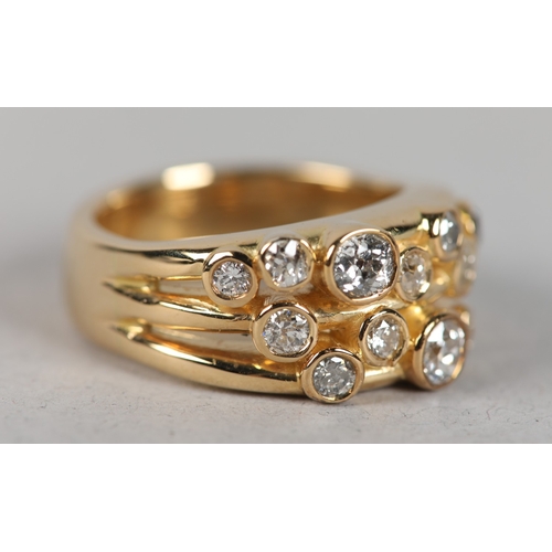 A DIAMOND RING, collet set with Old European and brilliant cut diamonds ...