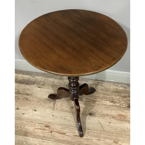 A Victorian mahogany tilt-top table, circular on turned column and ...
