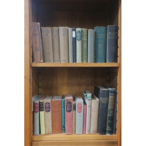 A COLLECTION OF VARIOUS BOOKS on three shelves to include one volume ...