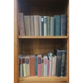 A COLLECTION OF VARIOUS BOOKS on three shelves to include one volume ...