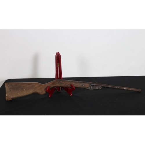 AN AIR RIFLE with teak stock and steel barrel