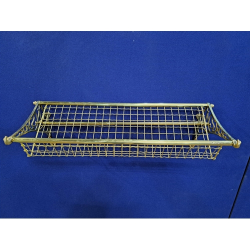 A BRASS WALL MOUNTED LUGGAGE RACK 25cm (h) x 76cm (w) x 30cm (d)