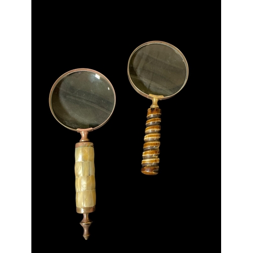 A COPPER MAGNIFYING GLASS with simulated Mother of Pearl handle ...