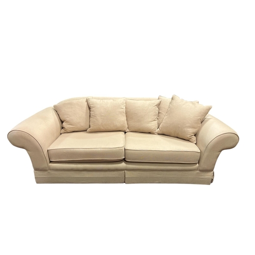 A VICTORIAN STYLE SETTEE with scroll over back and arms and loose ...