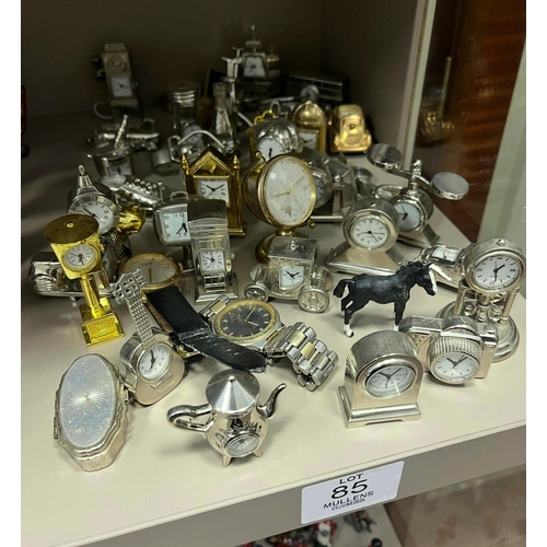 MINIATURE CLOCKS: A collection of miniature novelty clocks, various ...