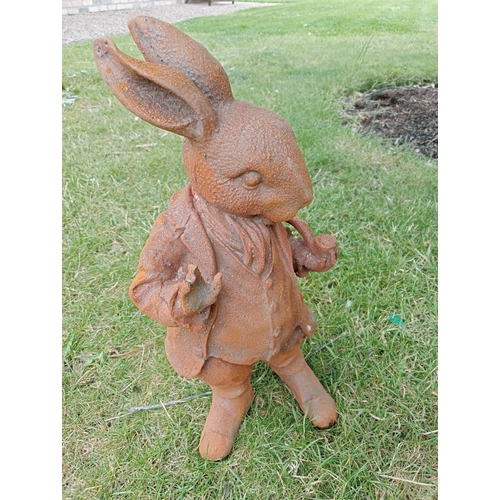 A PAIR OF CAST IRON FIGURES modelled as Peter Rabbit and Mr. Ratty 44cm ...