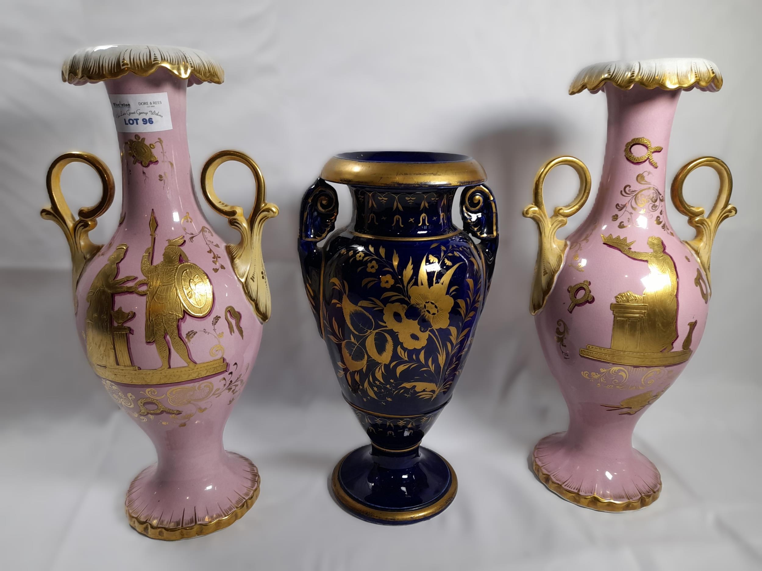 A PAIR OF CONTINENTAL PINK GLAZED VASES, the sides with Greco-Roman ...