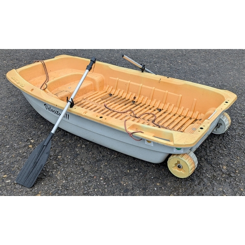 A BIC 245 Plastic Rowing Boat With Oars