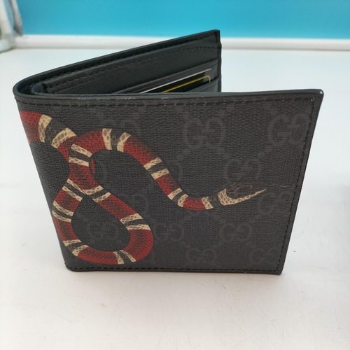 Gucci GG Supreme Kingsnake Print Bi-Fold Wallet.