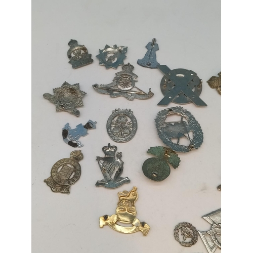 Large Mixed Collection of Broken Military Cap Badges.